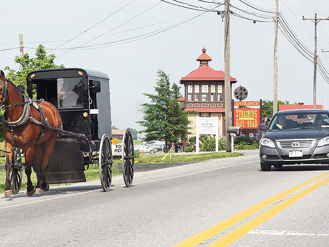 Where modern meets traditional &ndash; Amish buggies share the road with cars as they have for generations at Strasburg's iconic entrance.