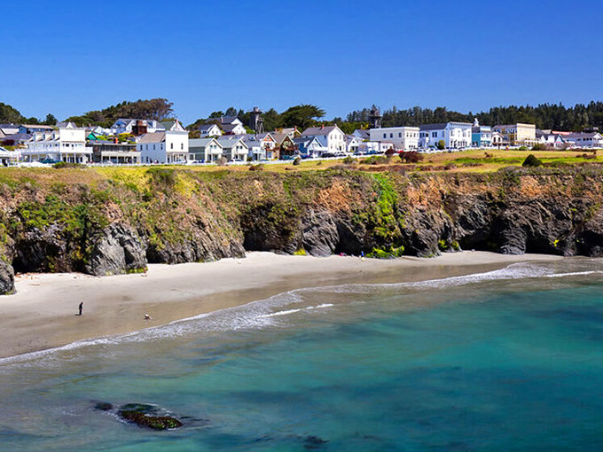 Perched dramatically on rugged cliffs, Mendocino's colorful Victorian homes stand like sentinels above the Pacific, where New England charm meets California's wild coastline.