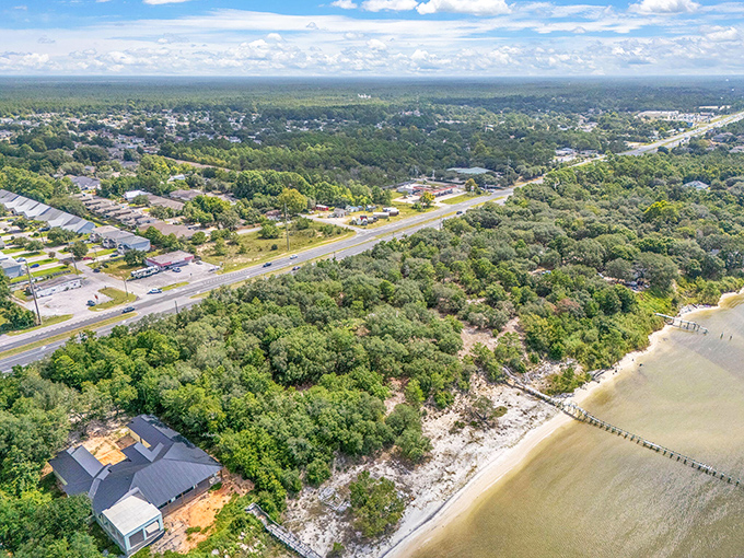 Navarre's lush greenery meets coastal charm in this aerial view, where nature and neighborhoods coexist in perfect Florida harmony.