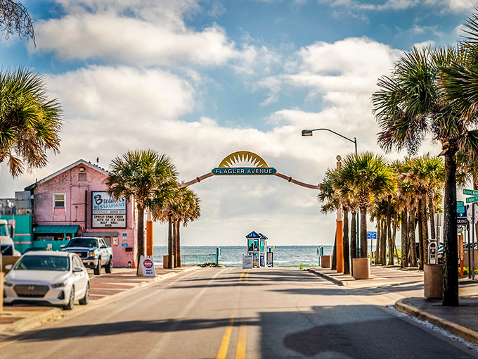 Palm trees frame this surf shop corner like nature's welcome committee. Edgewater's retail scene blends coastal cool with small-town charm.