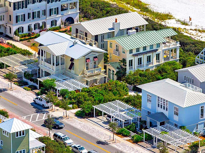 Seaside's iconic central amphitheater creates a perfect town circle, where palm trees stand sentinel around a gathering space that's equal parts community hub and architectural showpiece.