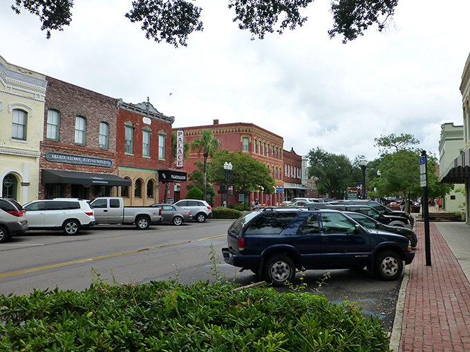 Historic red brick buildings stand proudly on Centre Street, where Victorian charm meets Florida sunshine in downtown Fernandina Beach.