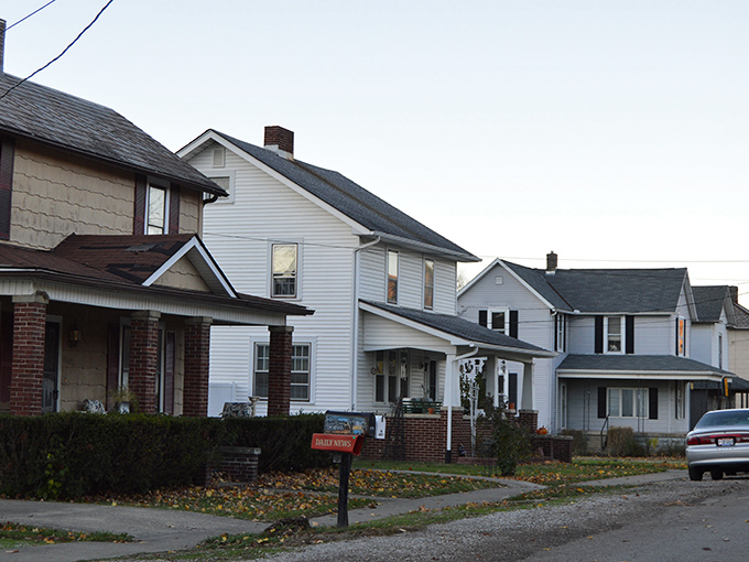 An aerial view of Rockbridge in autumn glory, where nature's paintbrush has created a masterpiece of reds and golds among the rolling hills.