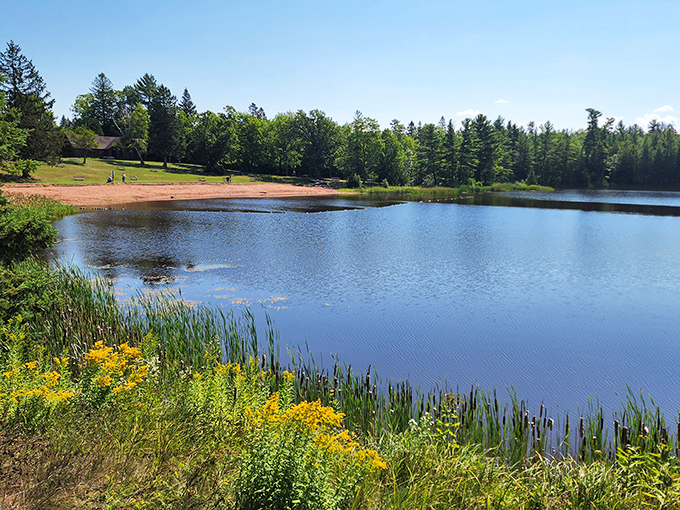 Interfalls Lake shimmers like nature's own infinity pool, complete with a sandy beach that rivals those postcard-perfect Caribbean spots—minus the passport requirement.
