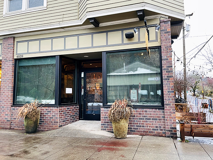 The unassuming exterior of Coquine belies the culinary magic happening inside. Like finding a Michelin-worthy meal in your neighbor's living room.