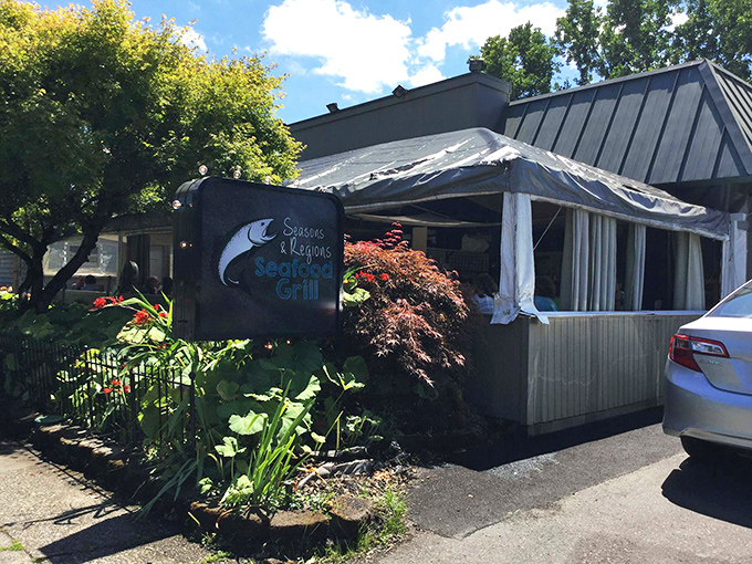 The unassuming exterior of Seasons & Regions Seafood Grill hides culinary treasures within, like a seafood speakeasy waiting to be discovered.