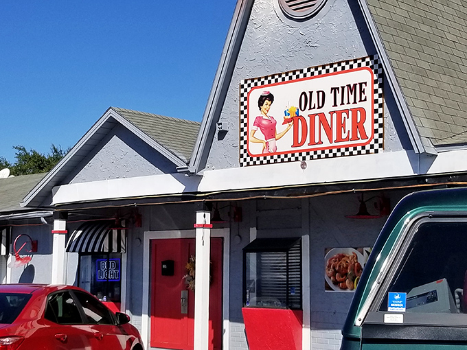 The classic checkered border on this sign isn't just decoration&mdash;it's a promise that what awaits inside is the real deal, no fancy pretensions required.