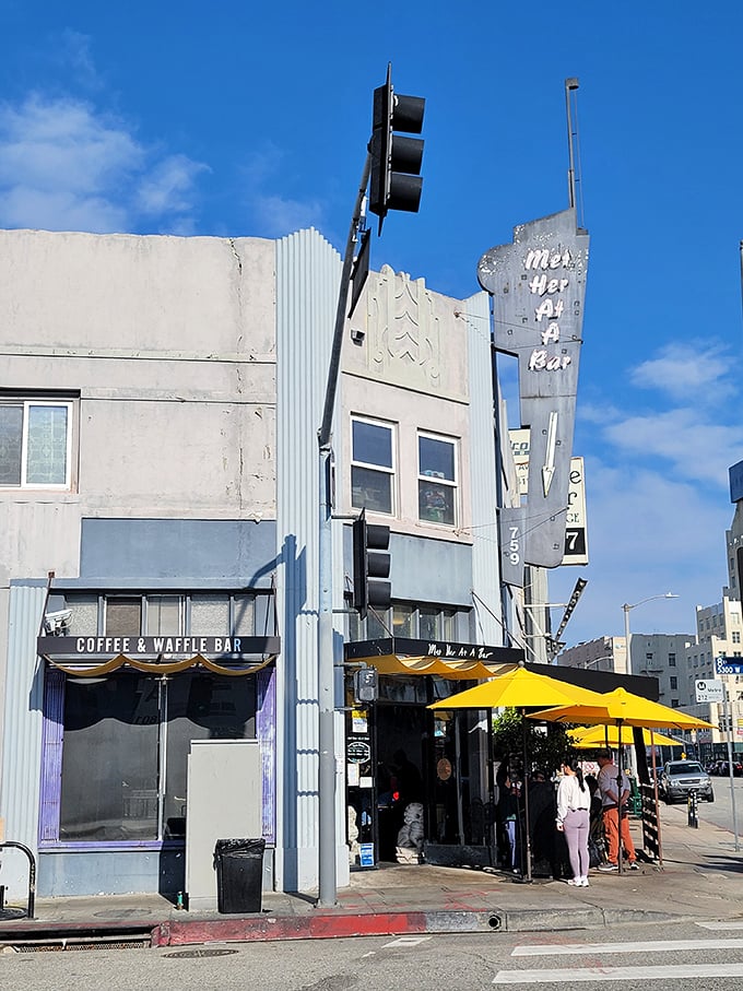 The Art Deco facade of Met Her At A Bar beckons with retro charm and sunny yellow accents, like a time capsule serving modern comfort food.