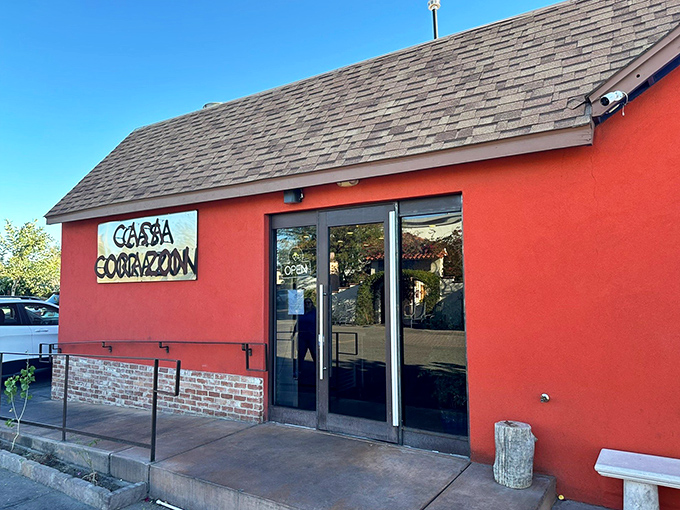 The coral-red exterior of Casa Coraz&oacute;n stands out like a delicious beacon in Phoenix, promising authentic flavors before you even step inside.