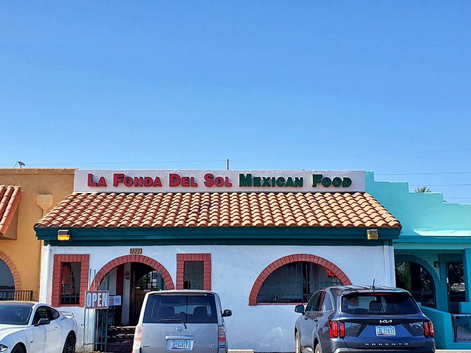 The classic white stucco, red-trimmed arches, and terracotta roof announce without fanfare: "Authentic Mexican food happens here." No neon needed.