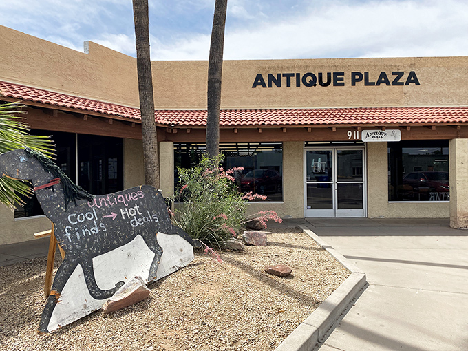 The unassuming exterior of Antique Plaza in Mesa hides a wonderland of vintage treasures. Like a time-travel portal disguised as a strip mall storefront!