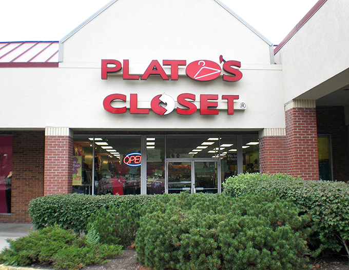 The iconic red Plato's Closet sign beckons like a lighthouse for the fashion-savvy and budget-conscious shopper. Treasure awaits inside!