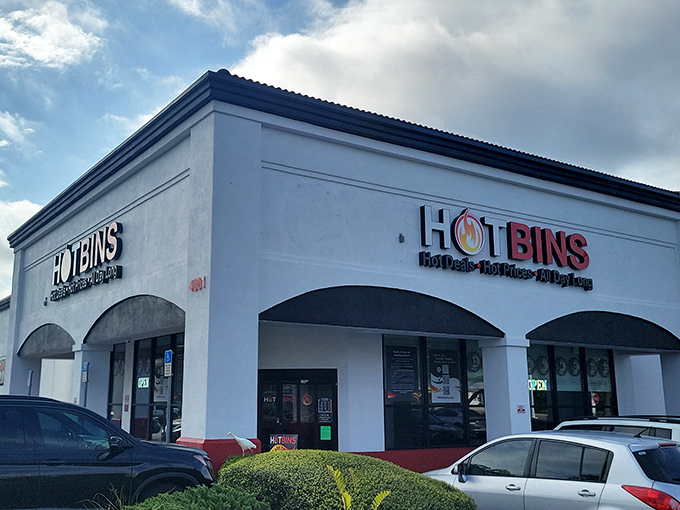 The white stucco facade of Hotbins gleams under Florida sunshine like a retail oasis. Behind those arched windows lies a bargain hunter's paradise that would make Marie Kondo hyperventilate.