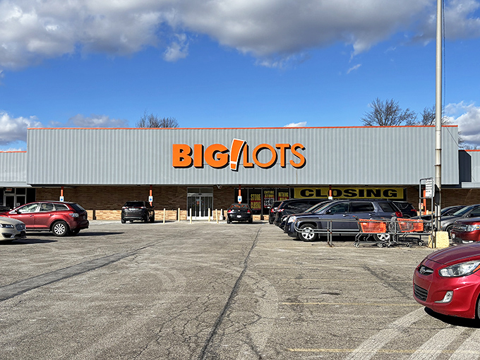 The iconic orange and black Big Lots sign stands like a beacon of bargain possibilities, promising treasure hunts where your wallet actually wins for once.