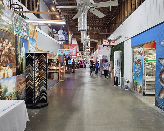 The main corridor of Red Barn Flea Market stretches before you like a treasure map come to life, with each storefront promising undiscovered gems.