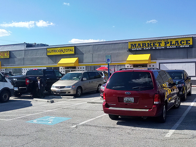 The bright yellow signage of Washington Boulevard Marketplace beckons like a lighthouse for treasure hunters. Weekend warriors, your bargain paradise awaits!