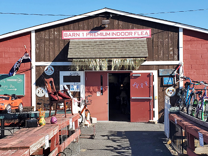 The rustic charm of Barn 1 beckons treasure hunters with its weathered wood and promise of premium finds hiding just beyond those red doors.