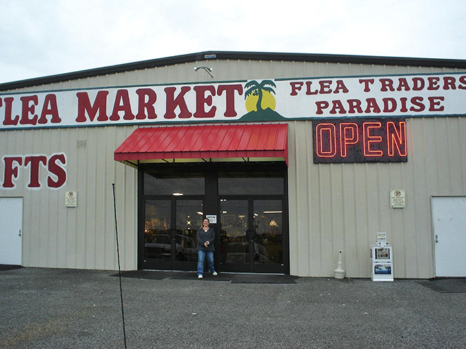 The unassuming exterior of Flea Traders Paradise belies the treasure trove waiting inside. That neon "OPEN" sign might as well say "Adventure Starts Here."