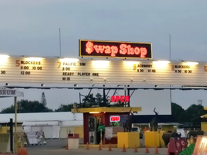 The iconic Swap Shop entrance, complete with movie listings and quirky elephant statues, welcomes treasure hunters to Florida's retail wonderland.