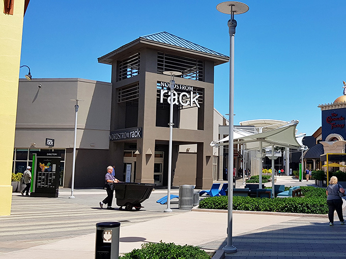 Nordstrom Rack stands like a retail lighthouse, beckoning bargain hunters to safe harbor. The Mediterranean-inspired architecture adds a touch of elegance to your discount quest.