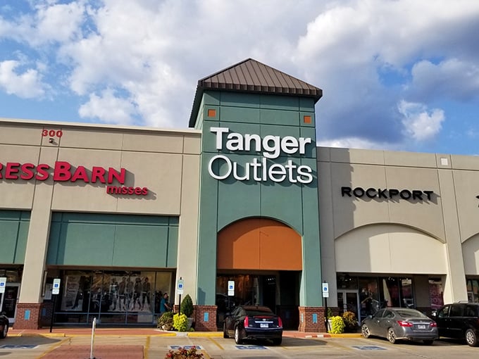 The iconic teal towers of Tanger Outlets welcome bargain hunters like beacons of hope in a sea of retail possibilities.