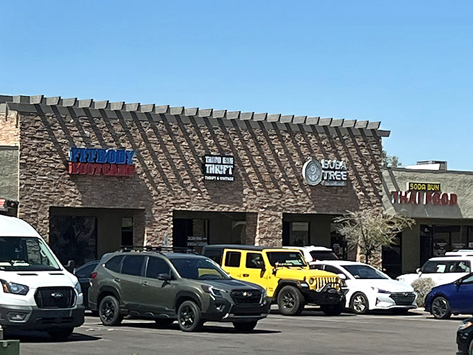 Third Eye Thrift nestles between a fitness bootcamp and boba shop, proving that treasure hunting and caffeine make perfect strip mall neighbors.