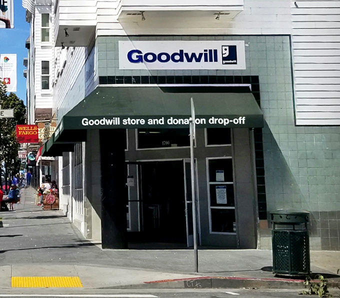 The iconic blue Goodwill sign beckons from the corner of Haight and Cole, a treasure cave disguised as a storefront in San Francisco's most colorful neighborhood.