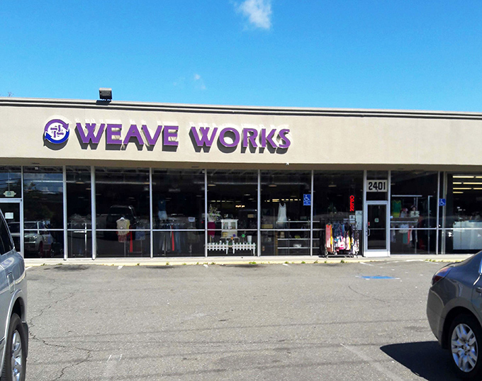 The purple-signed promise of WEAVE Thrift stands proudly against the Sacramento sky, beckoning bargain hunters and treasure seekers alike.