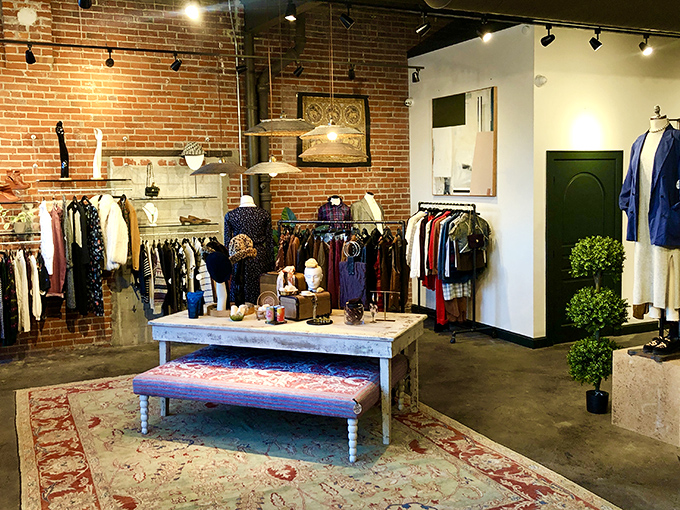 The sleek black storefront of Do Good Co. stands as an inviting portal to sustainable shopping adventures in Kansas City's historic West Bottoms.