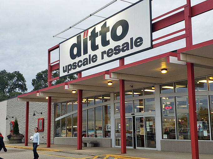 The red-trimmed facade of Ditto Upscale Resale stands like a beacon for bargain hunters. Michigan's temple of thrift beckons with promises of treasures within.