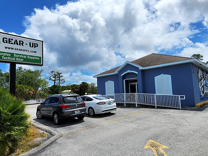 The bright blue exterior of Gear Up Surplus stands out against Florida's sky like a military-grade beacon for bargain hunters and adventure seekers alike.
