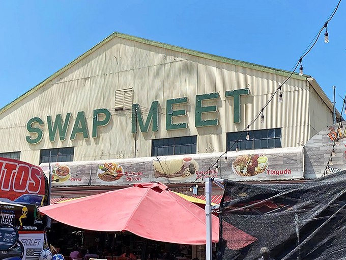 The iconic white buildings with bold green "SWAP MEET" lettering promise treasures inside that'll make your wallet sing with joy.
