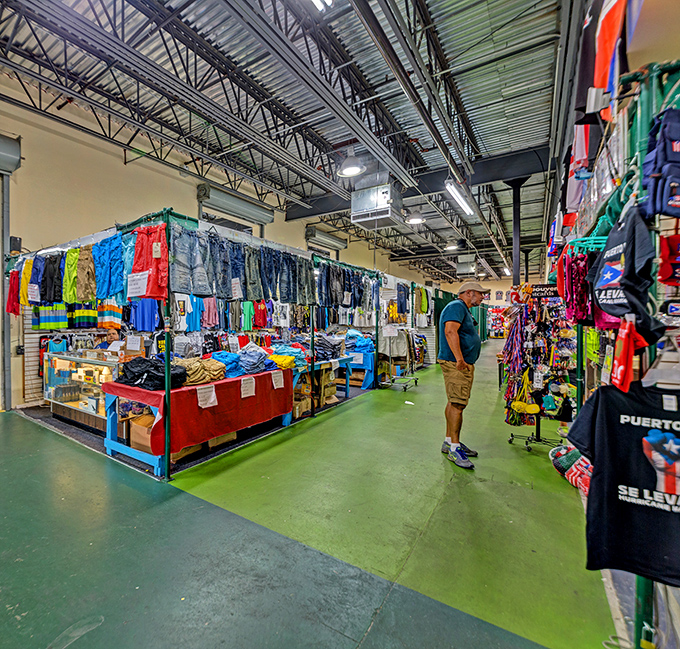 The patriotic exterior of Visitors Flea Market stands out like a retail Statue of Liberty, beckoning bargain hunters with its bold red, white, and blue facade.