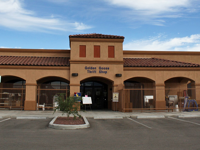 The unassuming exterior of Golden Goose Thrift Shop stands like a treasure chest in the desert, promising bargain-hunting adventures behind its Spanish-style fa&ccedil;ade.