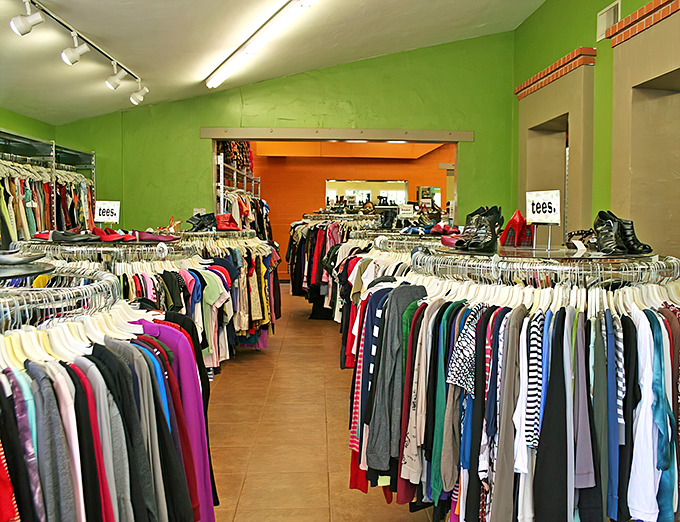 The iconic yellow exterior of Buffalo Exchange in Tucson pops against the Arizona sky like a fashion oasis, complete with that signature buffalo silhouette standing guard.