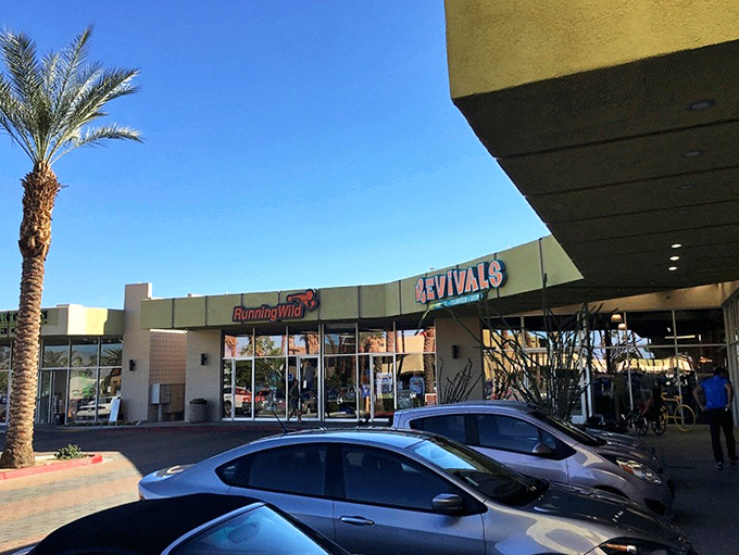 The desert sun bounces off Revivals' iconic orange signage like it's auditioning for a Wes Anderson film. Palm Springs architecture at its thrifty finest.