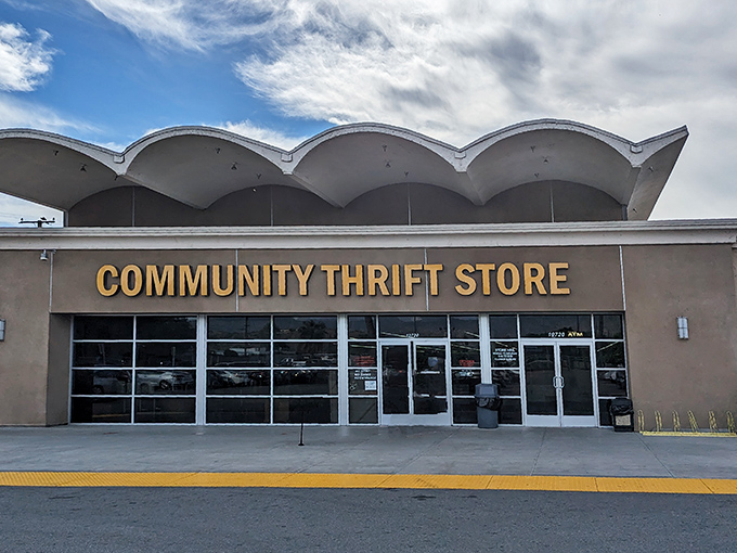 The distinctive wavy roofline of Community Thrift Store stands out against the California sky, like a mid-century modern treasure waiting to be discovered.