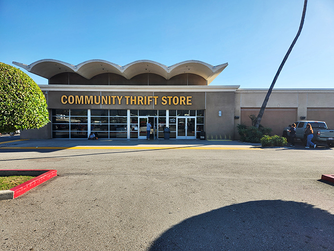 The distinctive wavy roofline of Community Thrift Store stands out against the California sky, like a mid-century modern treasure waiting to be discovered.