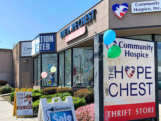 The cheerful exterior of Hope Chest Thrift Store beckons with colorful balloons and promises of treasures within. Bargain hunting never looked so inviting!