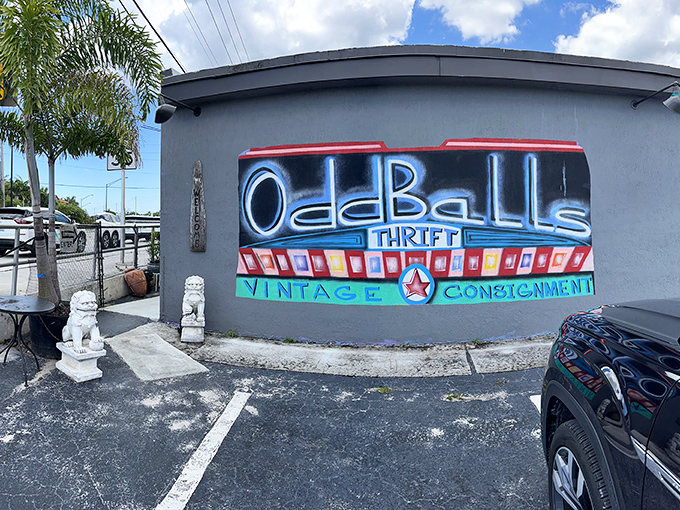 The neon-bright sign of Oddballs glows against its gray exterior like a beacon for bargain hunters. Guardian lion statues stand watch, promising treasures within.