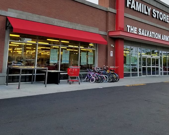 The red shopping carts lined up like eager treasure hunters, ready for their next adventure at this unassuming brick fortress of finds.