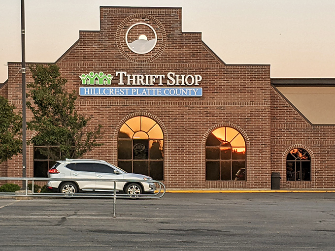 The stately brick fa&ccedil;ade of Hillcrest Thrift Shop stands proudly against a blue Missouri sky, promising treasure hunters adventures that await inside.