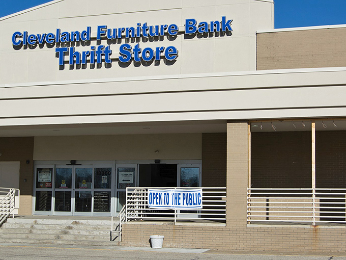 The blue sign beckons like a lighthouse to bargain hunters &ndash; Cleveland Furniture Bank Thrift Store, where wallet-friendly treasures await.
