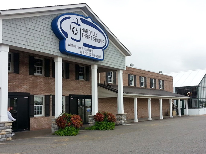 The iconic blue sign welcomes bargain hunters to this brick-and-column treasure trove where every purchase truly feels like a gift to your wallet.