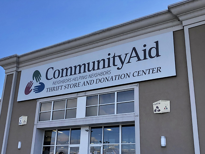 The promise of treasure hunting begins right at the entrance, where CommunityAid's colorful logo signals the start of your bargain adventure.