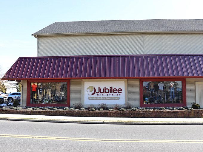 The burgundy awning of Jubilee Thrift beckons like a portal to treasure-hunting paradise, promising adventures in secondhand splendor behind those unassuming walls.