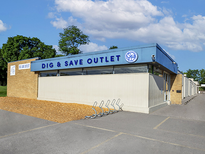 The unassuming blue facade of Dig & Save Outlet hides a treasure trove within—like finding a secret portal to bargain heaven in Madison.