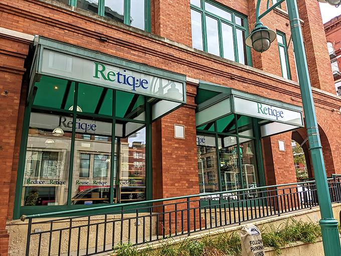 The distinctive brick facade of Retique welcomes bargain hunters with its elegant green signage &ndash; Milwaukee's worst-kept secret for fashionistas on a budget.