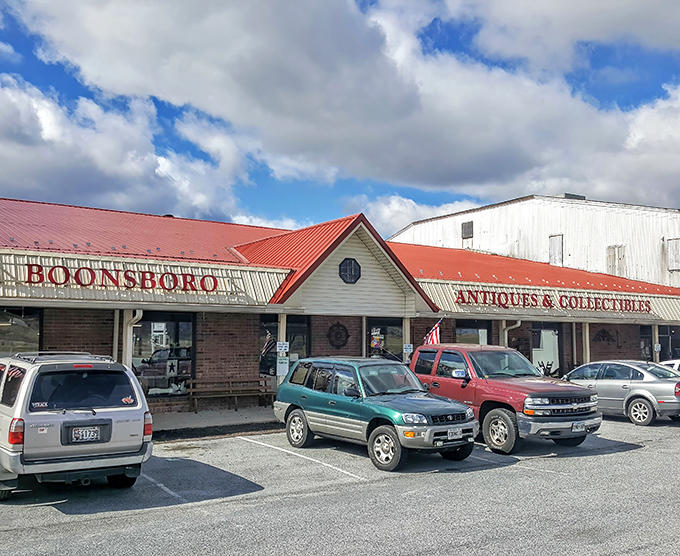 The iconic red roof of Boonsboro Antiques beckons like a lighthouse for treasure hunters navigating the sea of Maryland's countryside.