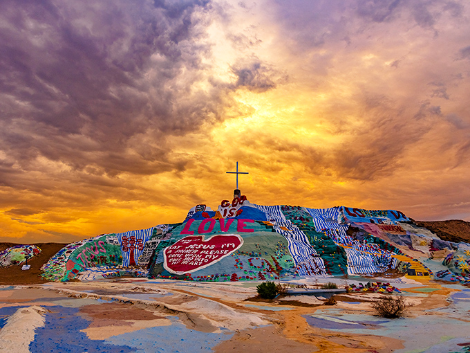 Sunset transforms Salvation Mountain into a psychedelic dream, where the desert sky and painted hillside compete for which can be more dramatically colorful.